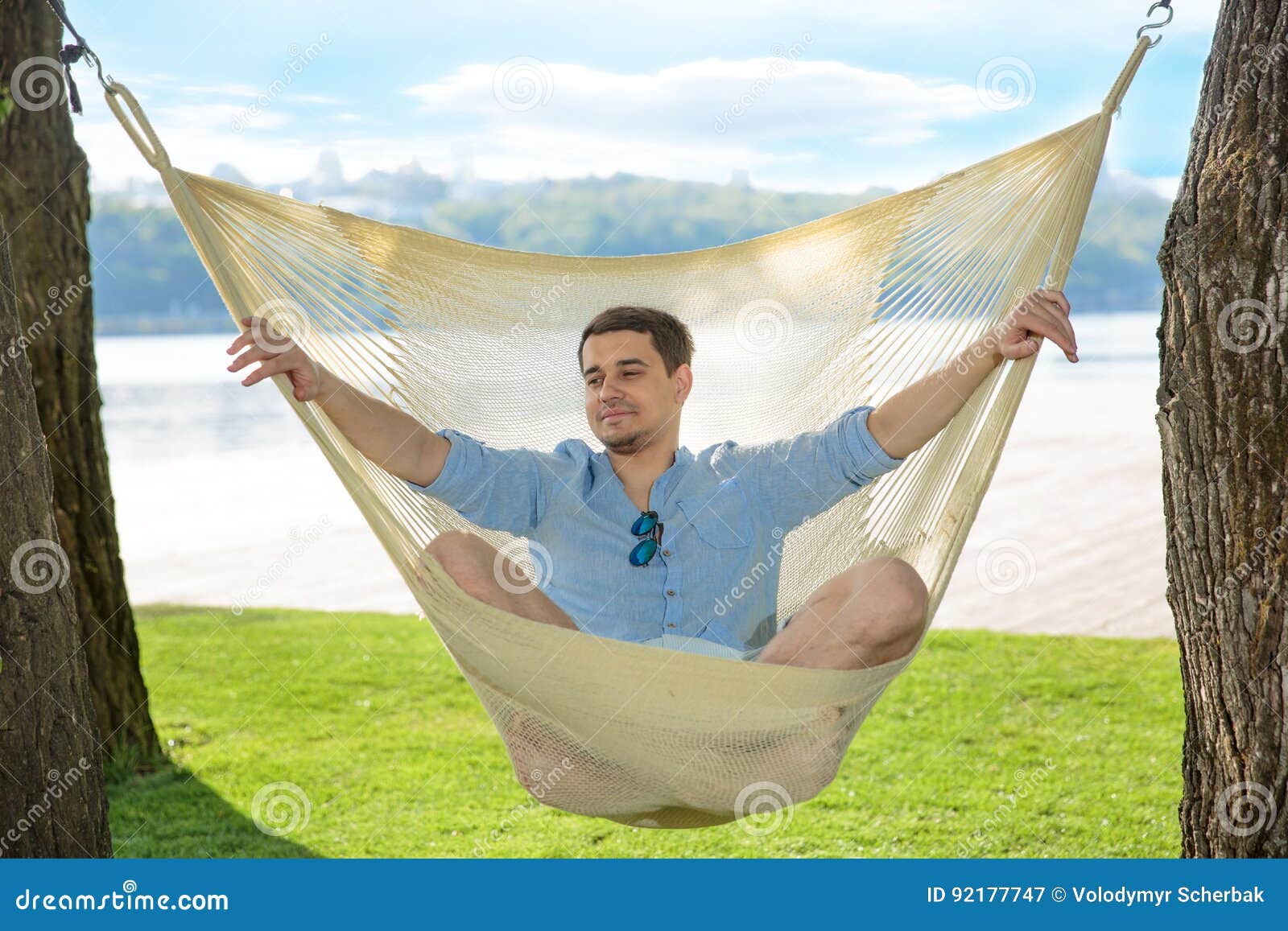 Man relaxing in hammock stock image. Image of face, beautiful - 92177747