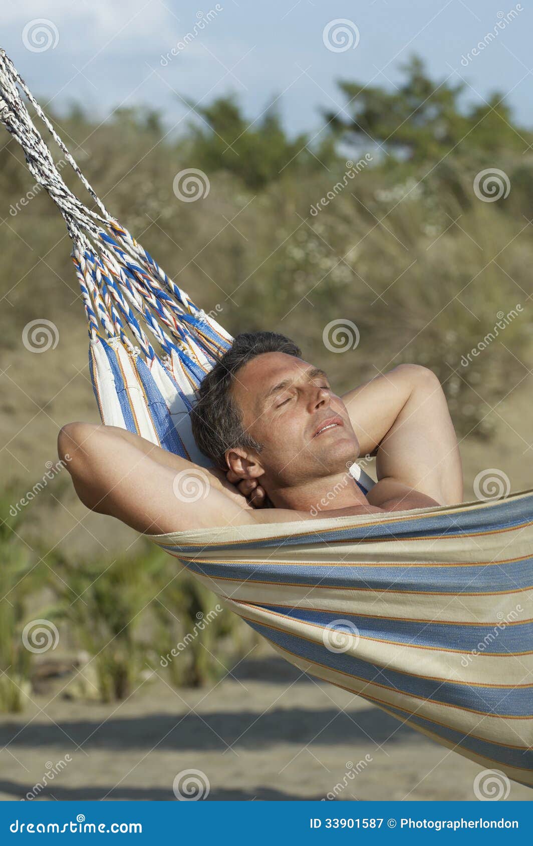 Man Relaxing in Hammock stock image. Image of focus, asleep - 33901587