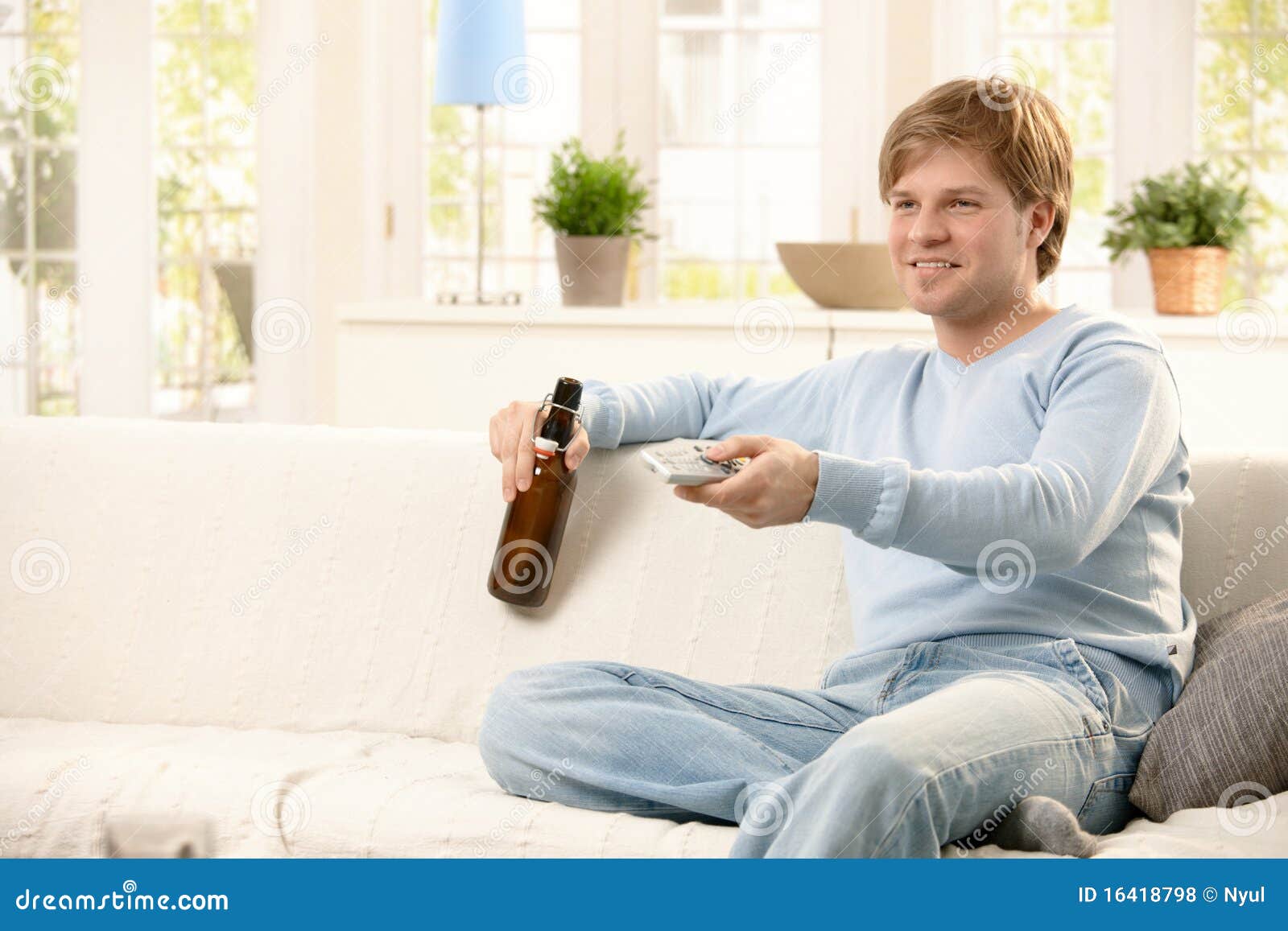 Man relaxing at home stock photo. Image of handsome, cosy - 16418798