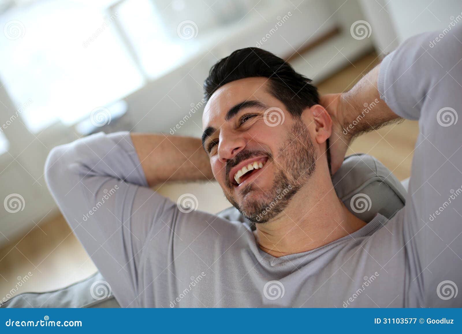 Man Relaxing at Home with Hands Behind Head Stock Image - Image of sofa ...