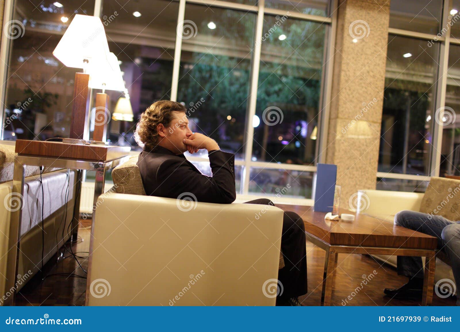 Man Relaxing in Hotel Lobby Stock Image - Image of anxious, anticipate ...