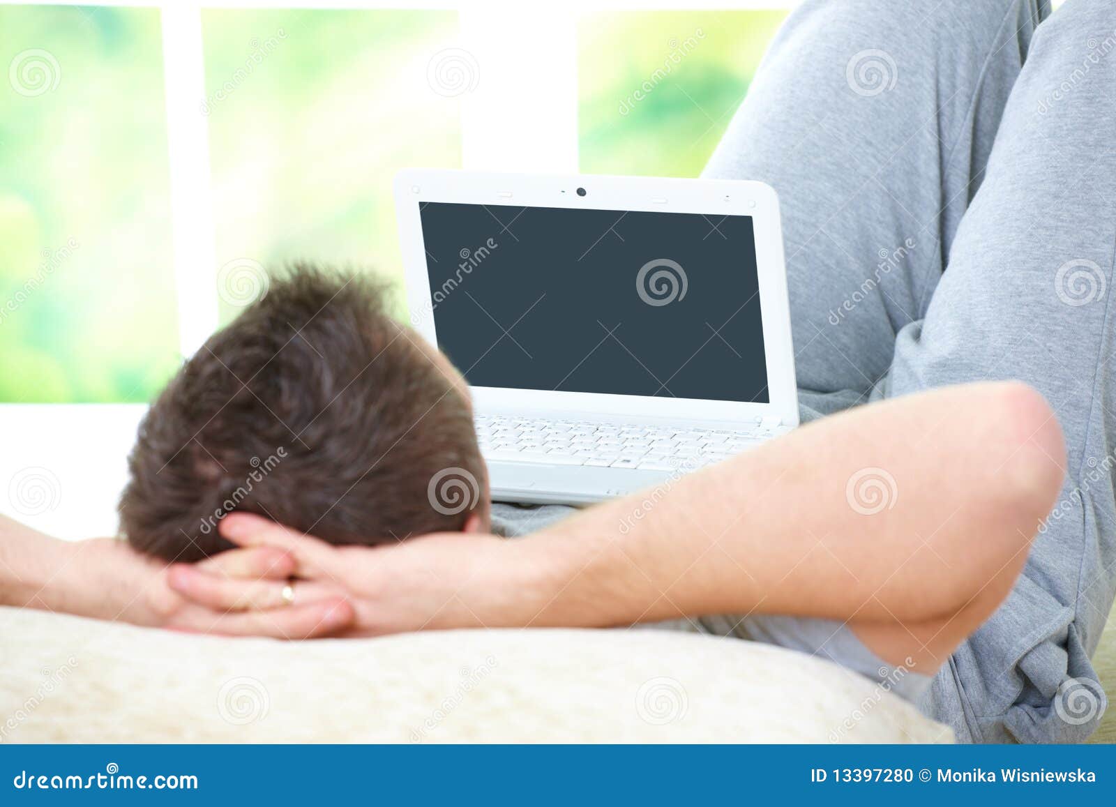 Man relaxing with laptop stock photo. Image of comfortable - 13397280