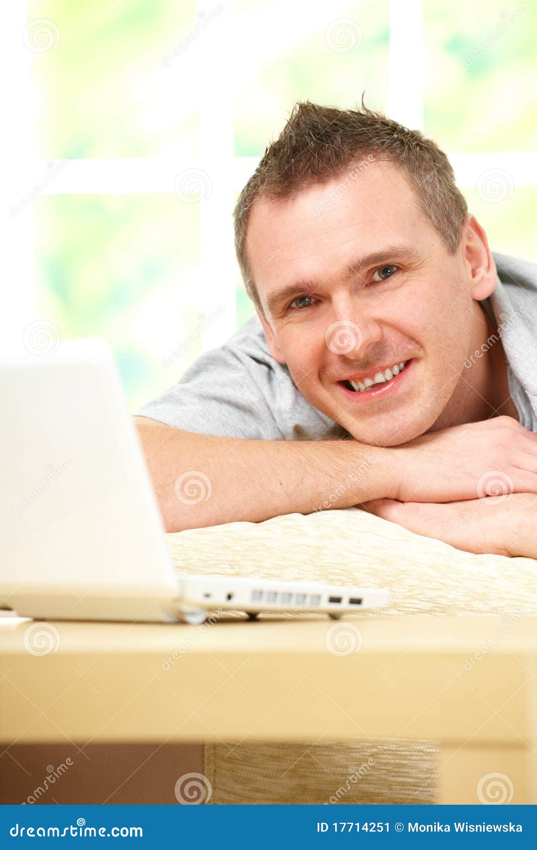 Man relaxing with laptop stock image. Image of grey, life - 17714251