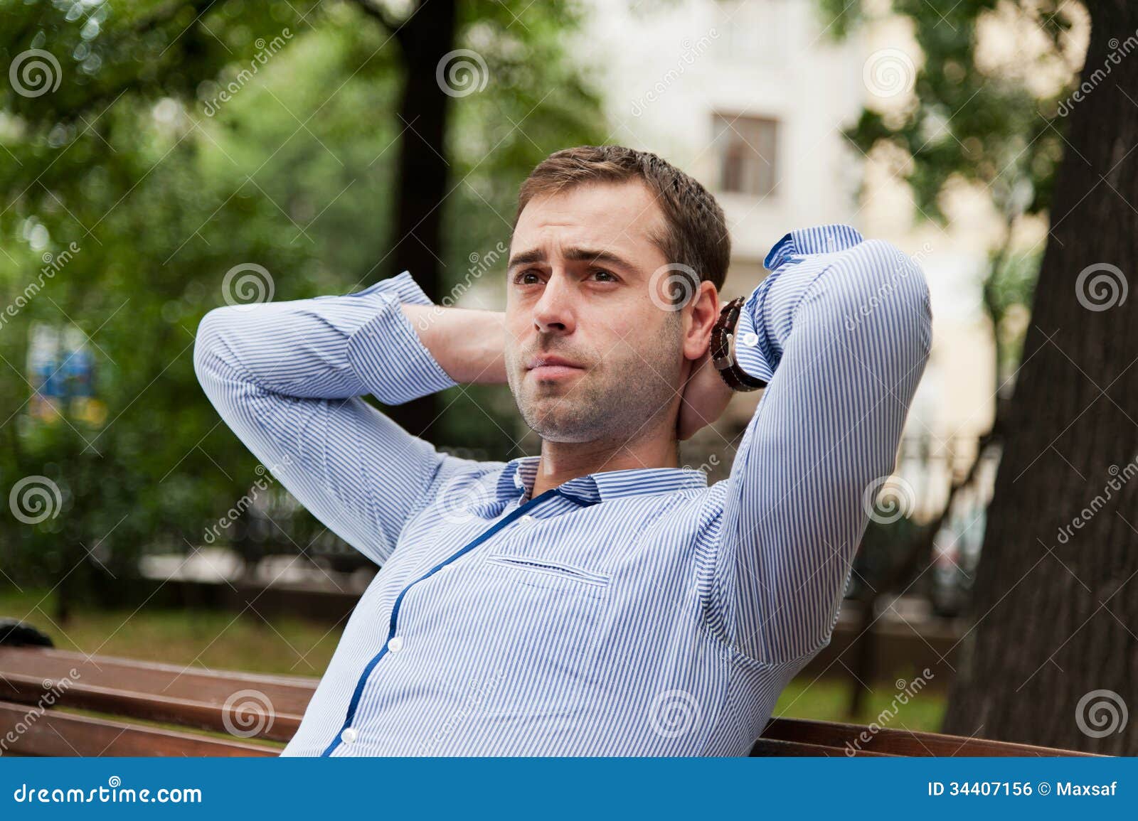 Man Relaxing in the Public Garden Stock Photo - Image of hands, adult ...