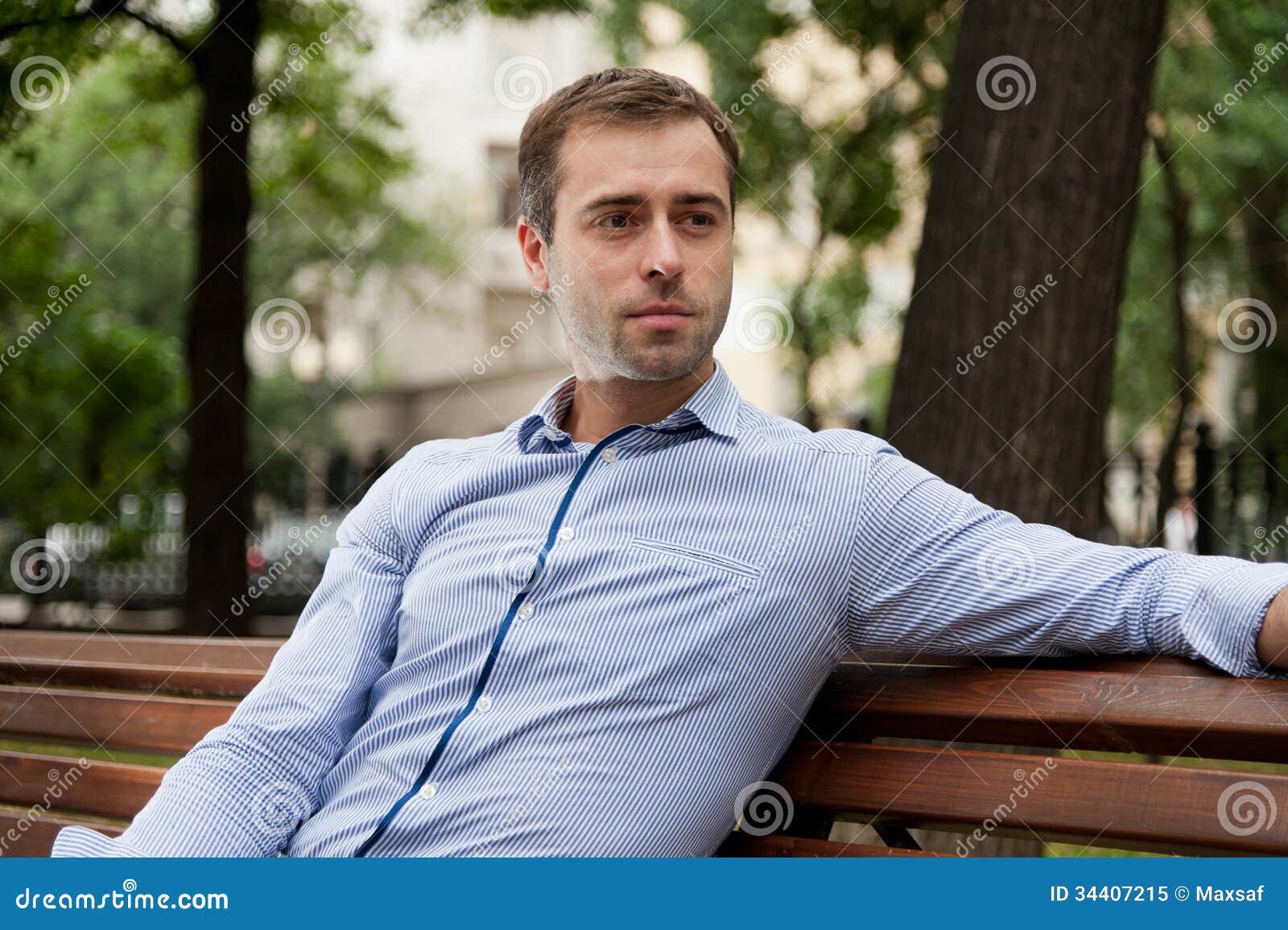 Man Relaxing in the Public Garden Stock Image - Image of shirt, happy ...