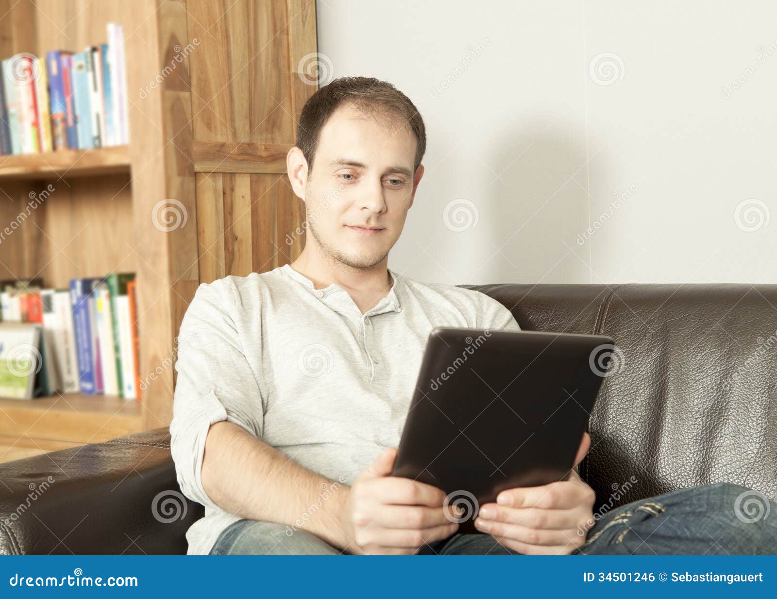 Man Relaxing Reading an E-book Stock Photo - Image of hobby, casual ...