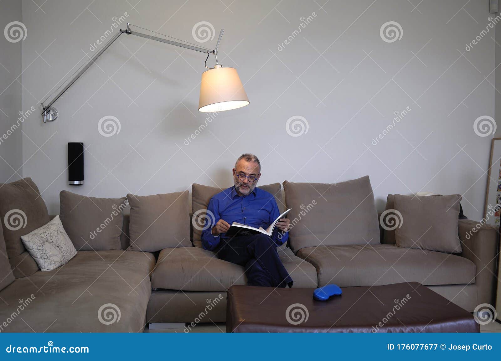 Man Relaxing and Reading on a Sofa Stock Image - Image of senior ...