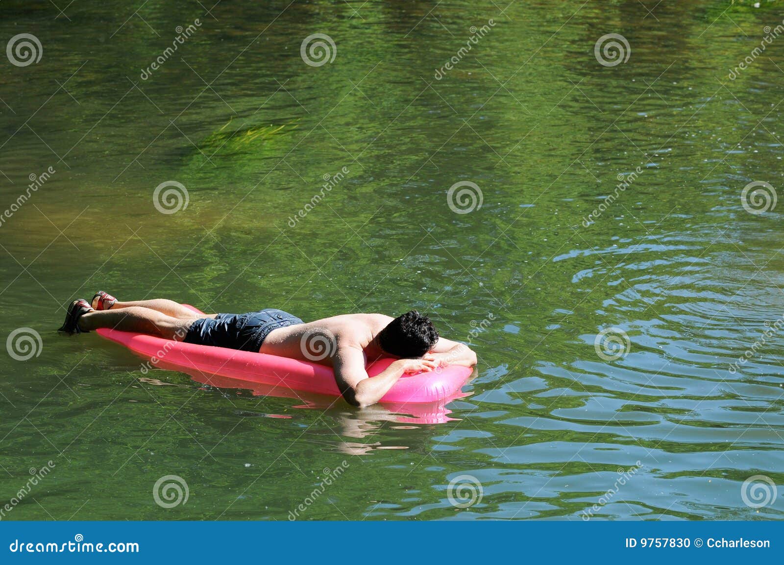 Man relaxing on river stock photo. Image of solitude, swim - 9757830