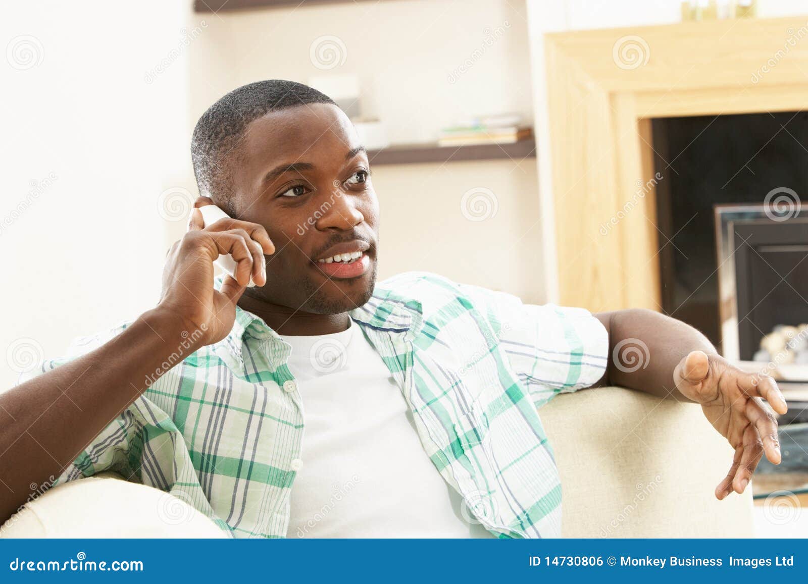 Man Relaxing Sitting on Sofa Talking on Phone Stock Photo - Image of ...