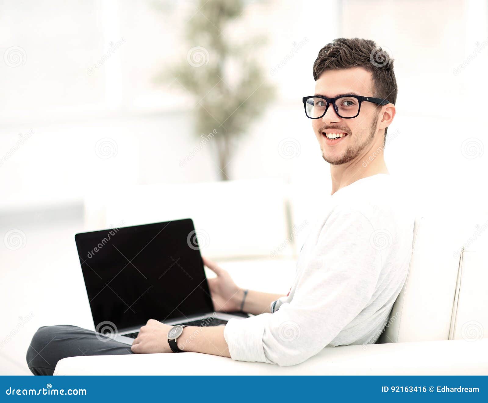 Man Relaxing on Sofa with Laptop Computer Stock Photo - Image of ...