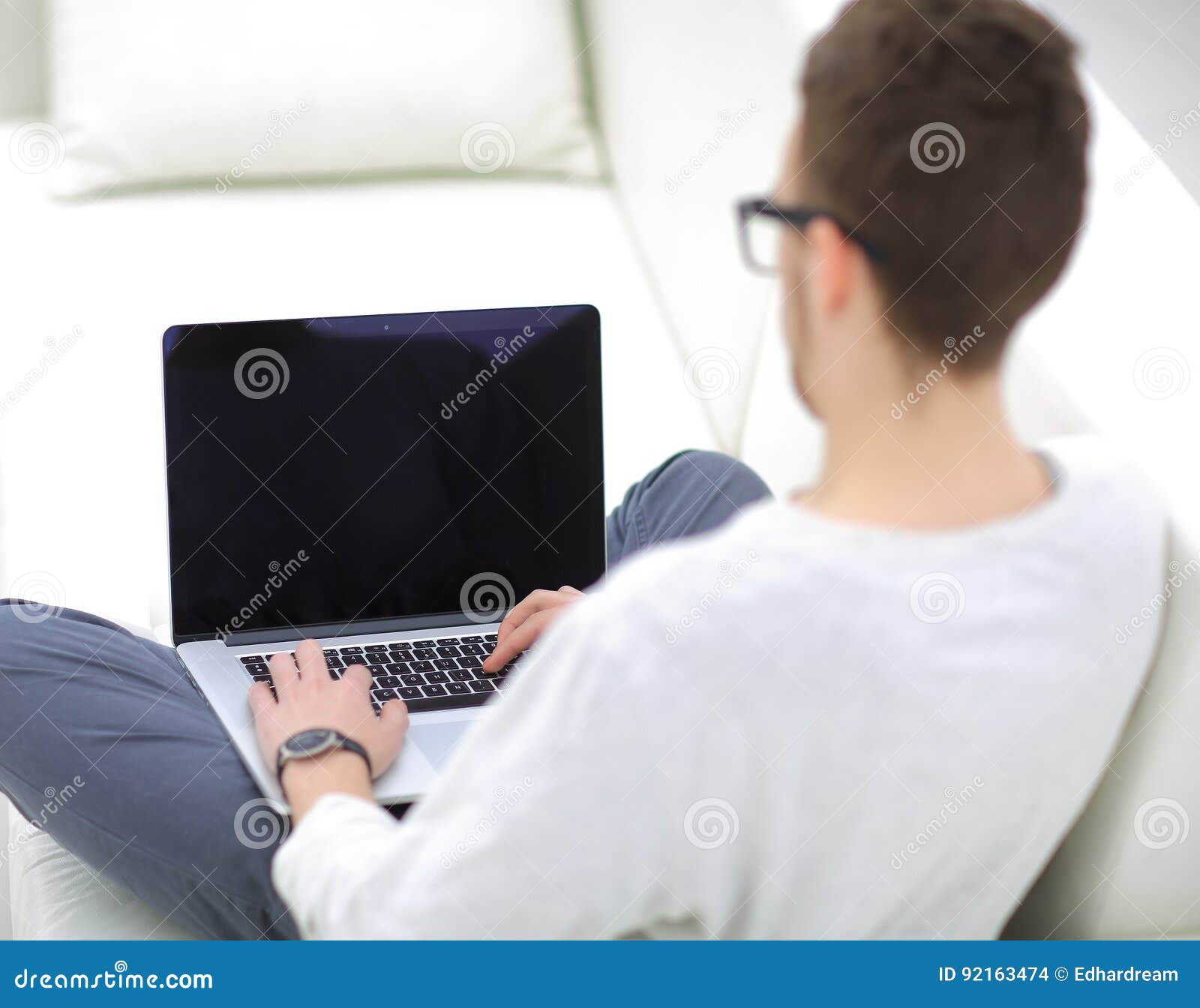 Man Relaxing on Sofa with Laptop Computer Stock Photo - Image of modern ...