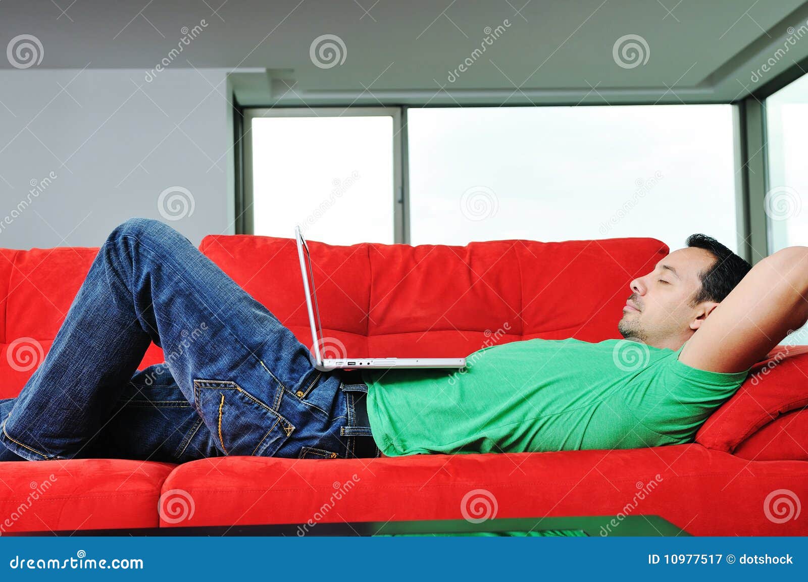 Man Relaxing on Sofa and Work on Laptop Computer Stock Image - Image of ...