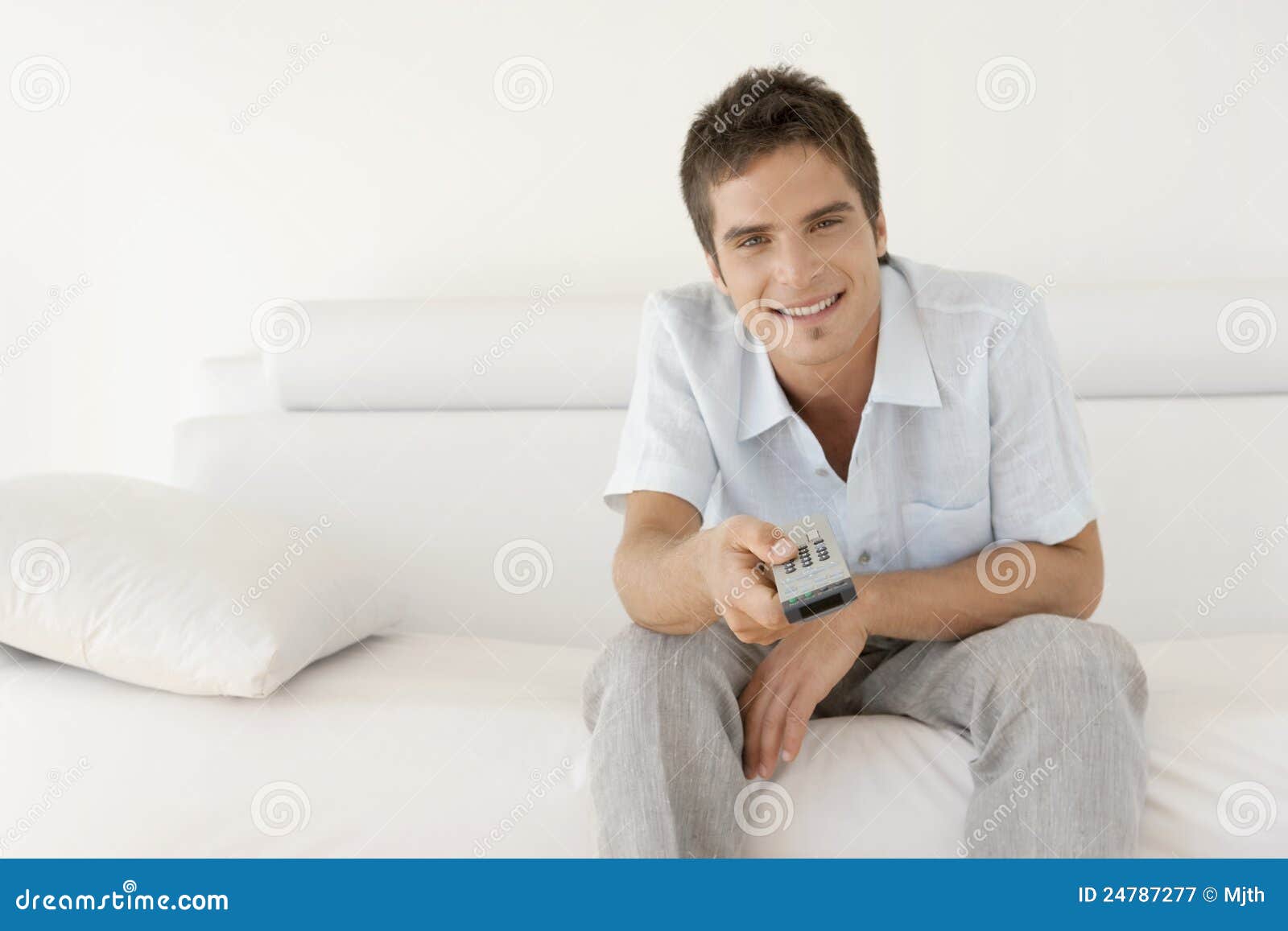 Man Relaxing Using Remote Control Stock Image - Image of expensive ...