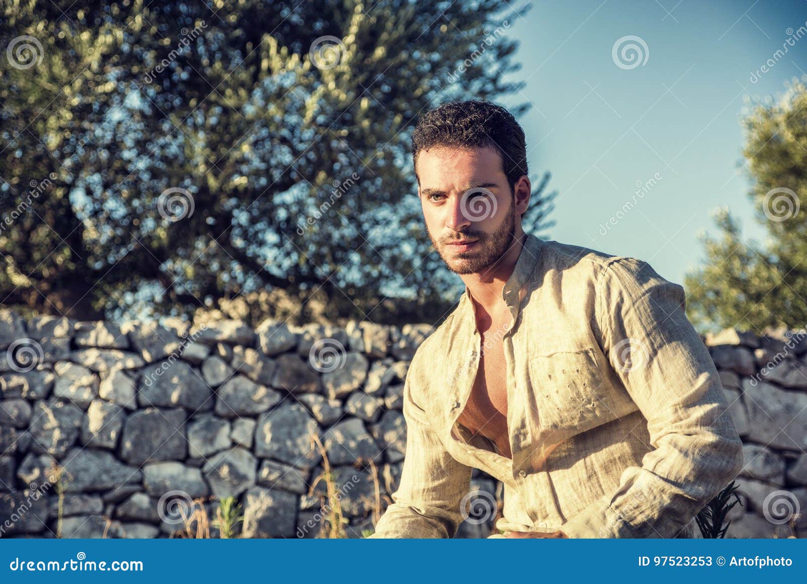 Man Relaxing in Warm Sunlight among Trees Stock Image - Image of cowboy ...