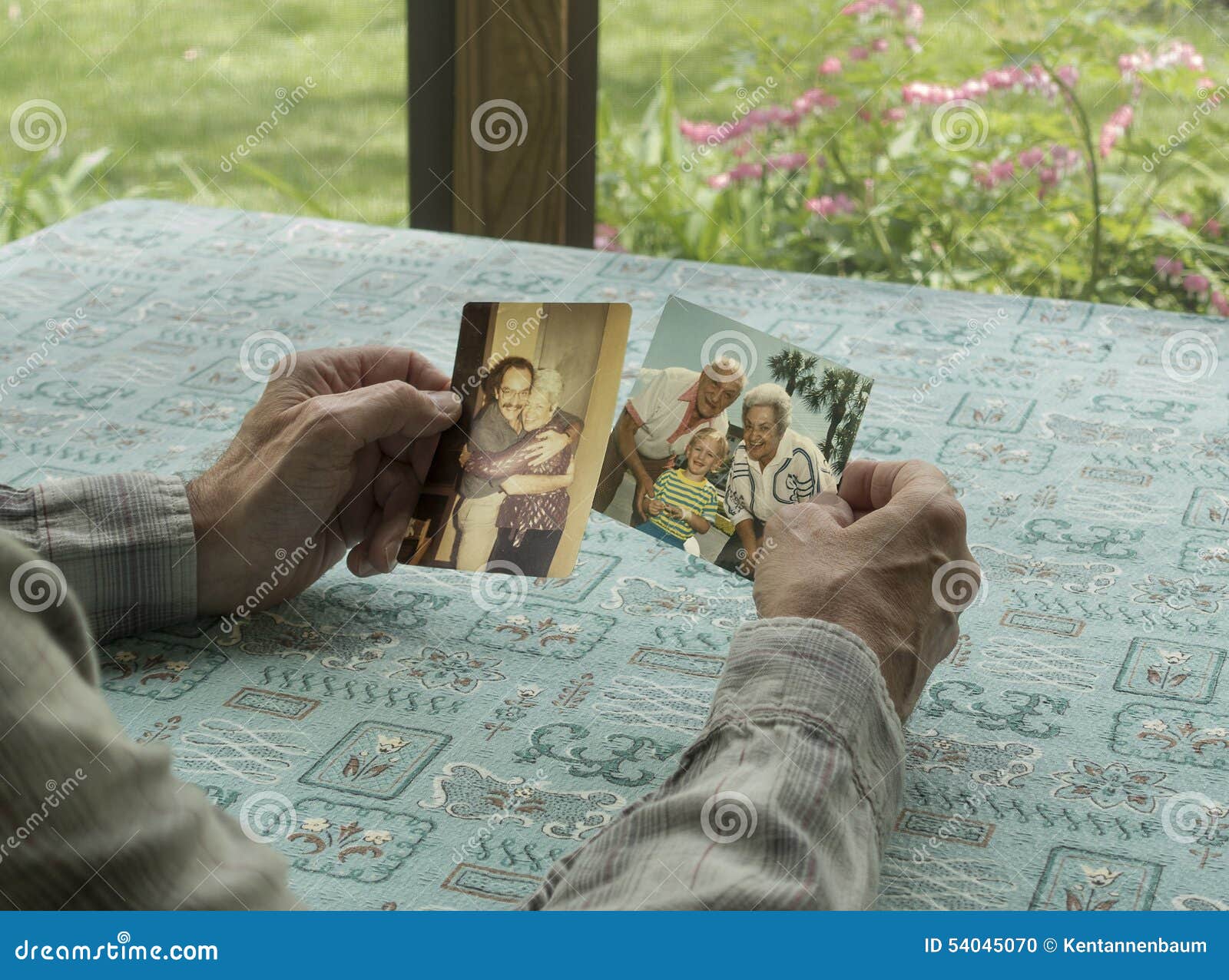 Man Reminiscing with Photos Stock Photo - Image of elderly, senior ...