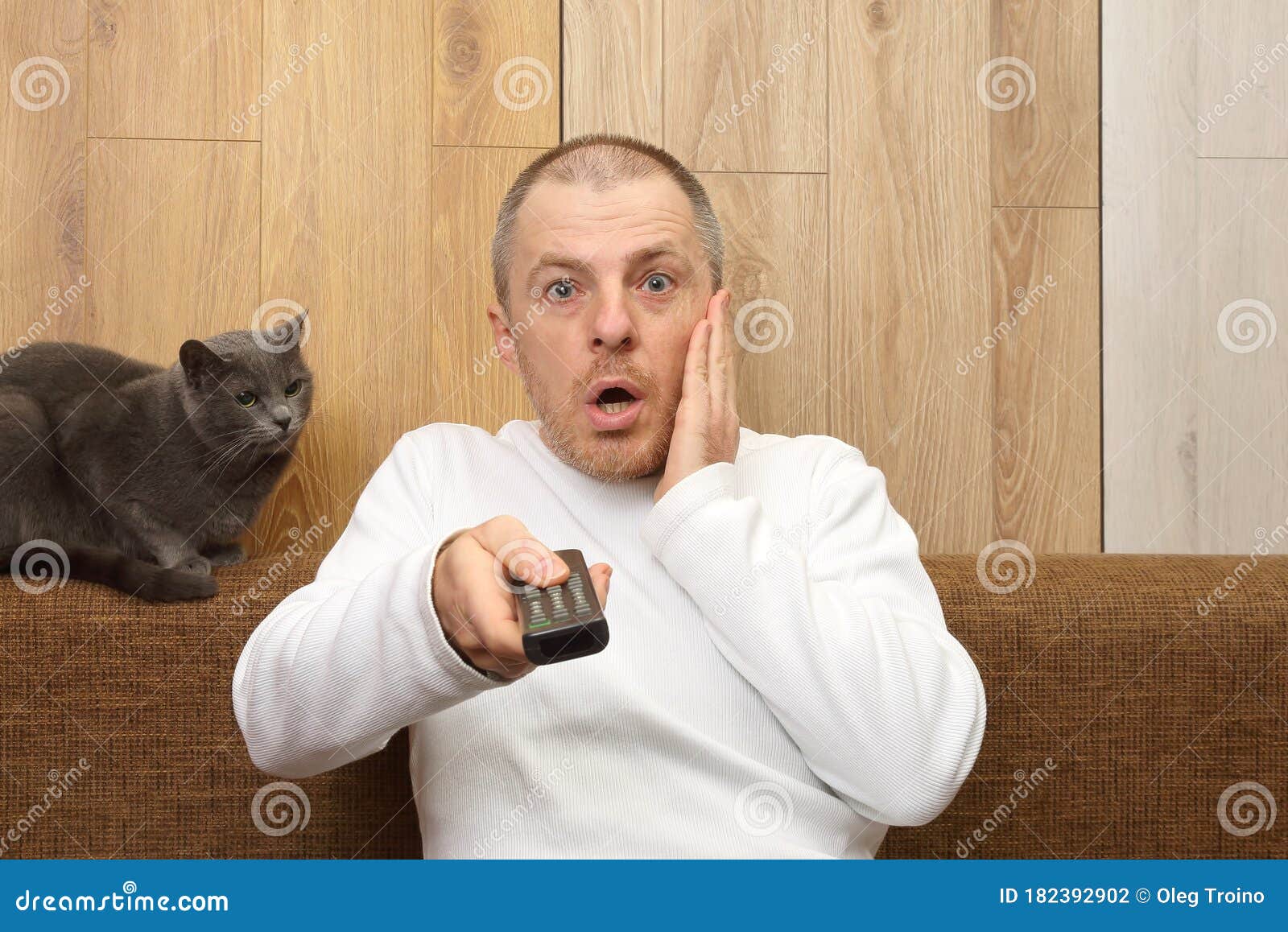 The Man with the Remote Control in Great Amazement Looking at the ...