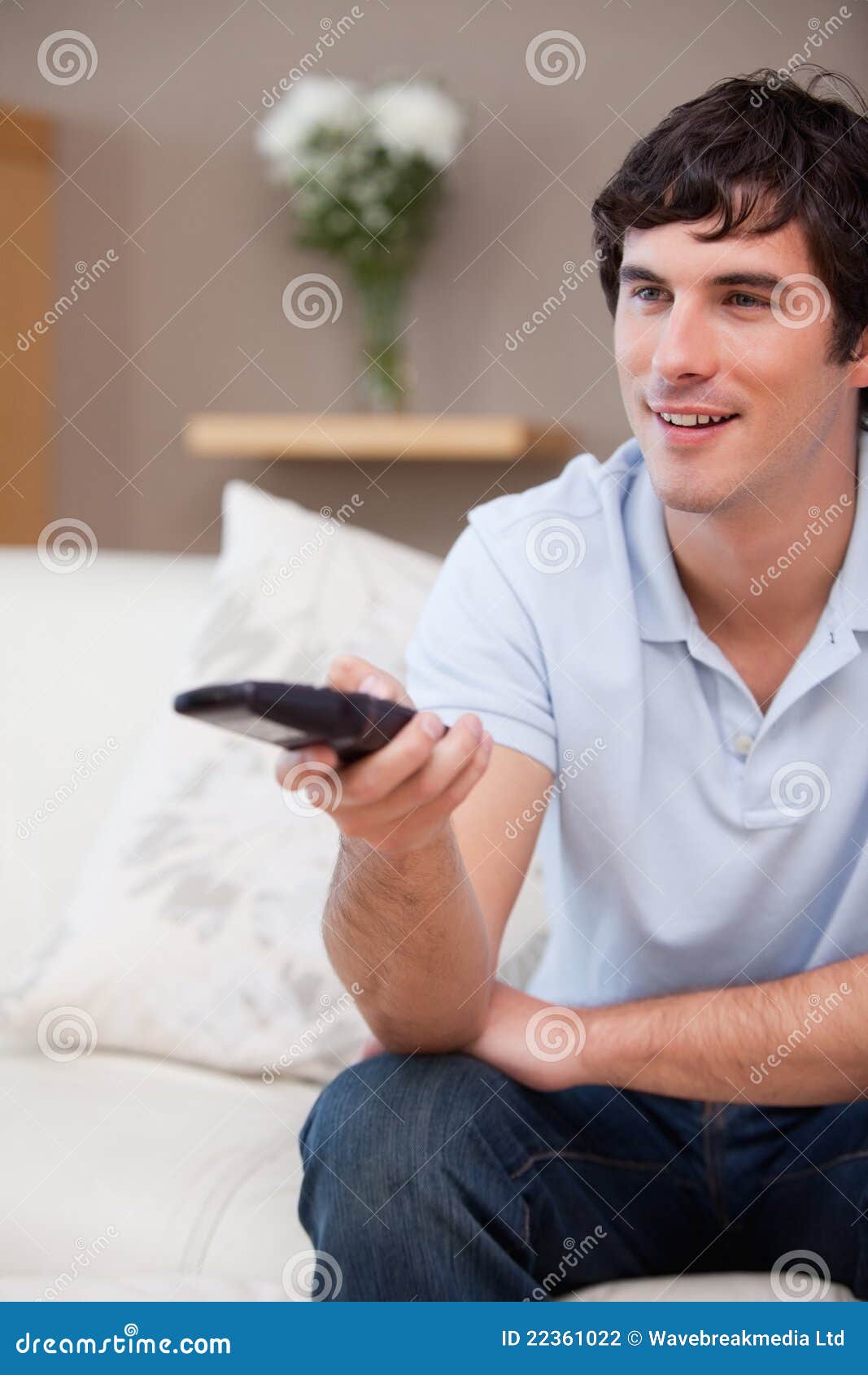 Man with Remote Control on the Sofa Stock Photo - Image of appearance ...