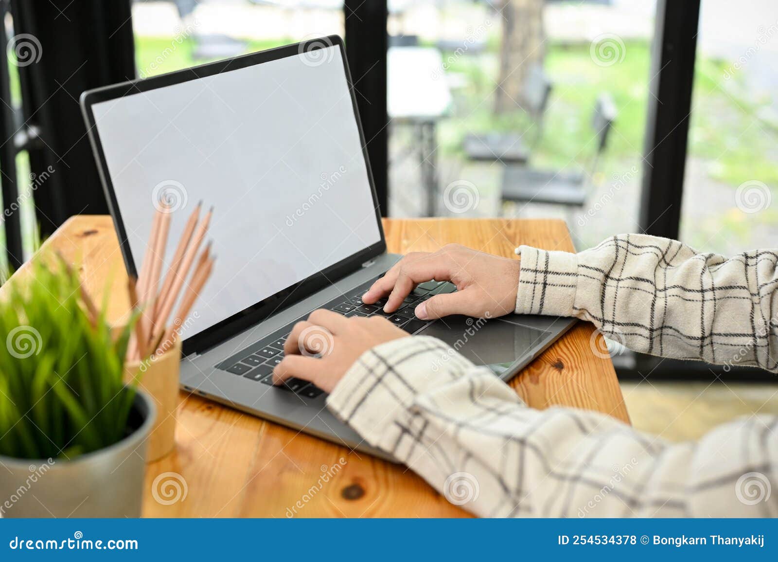 A Man Using Notebook Laptop Computer, Typing on Keyboard. Laptop White ...