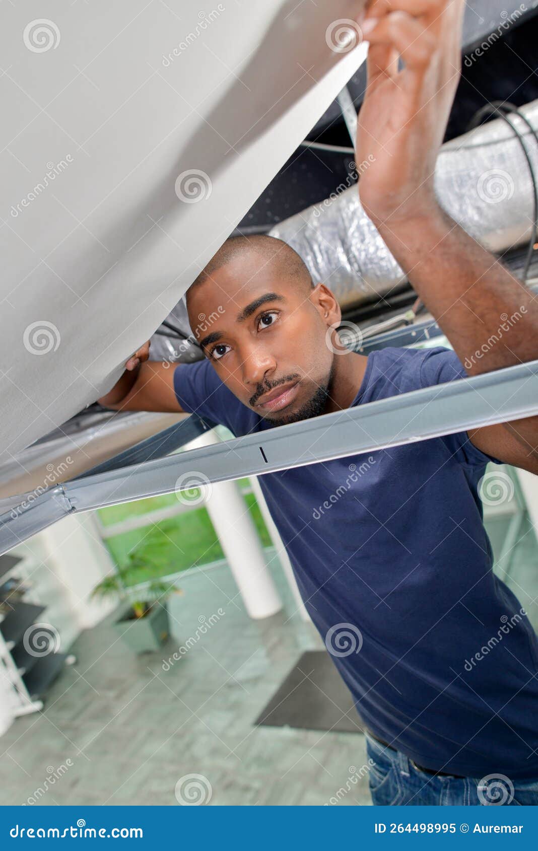 Man Removing Ceiling Panels Stock Image - Image of equipment ...