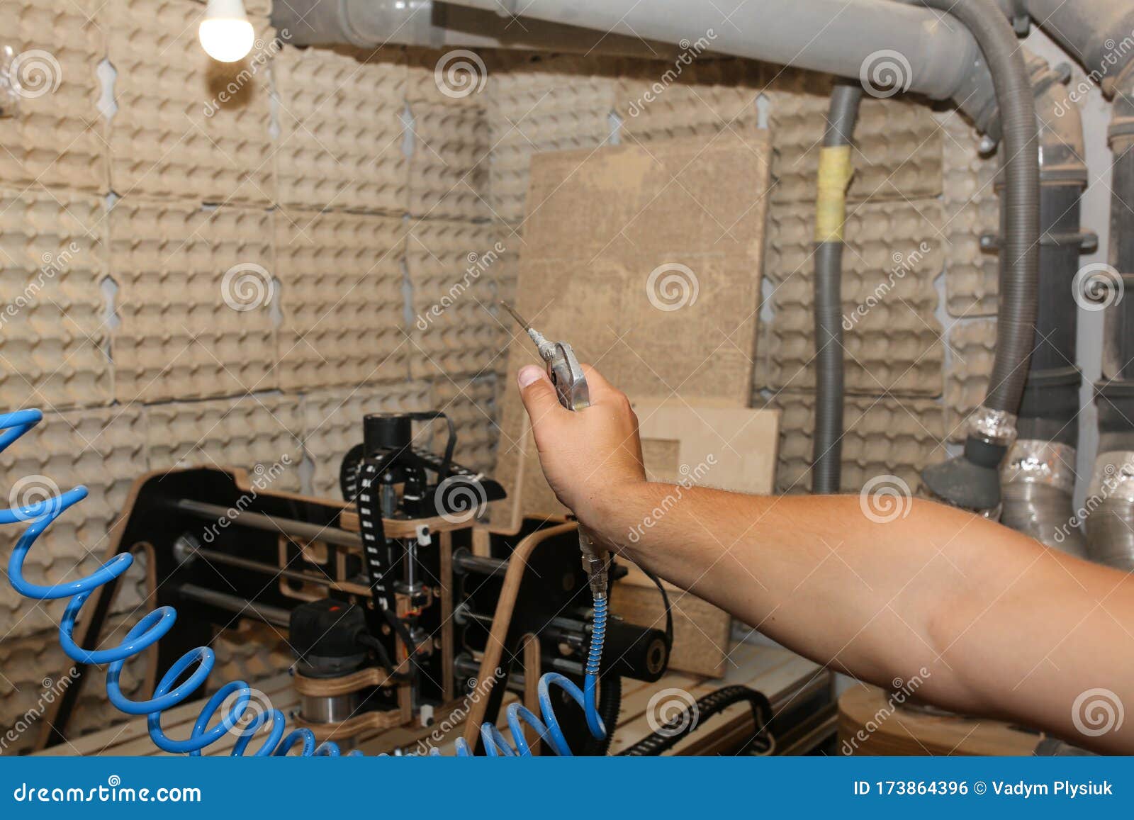 Man is Removing Dust from the Computer Numerical Control Machine for ...