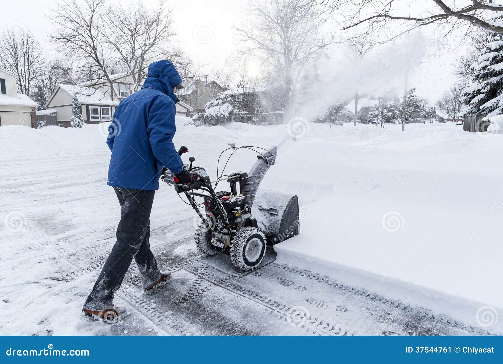 Man Removing Snow with a Snow Blower #1 Stock Image - Image of street ...