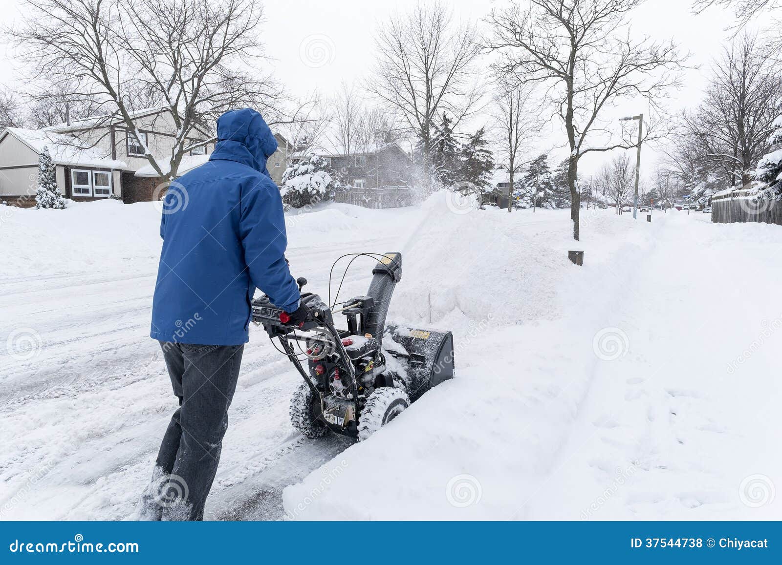 Man Removing Snow with a Snow Blower #3 Stock Photo - Image of street ...