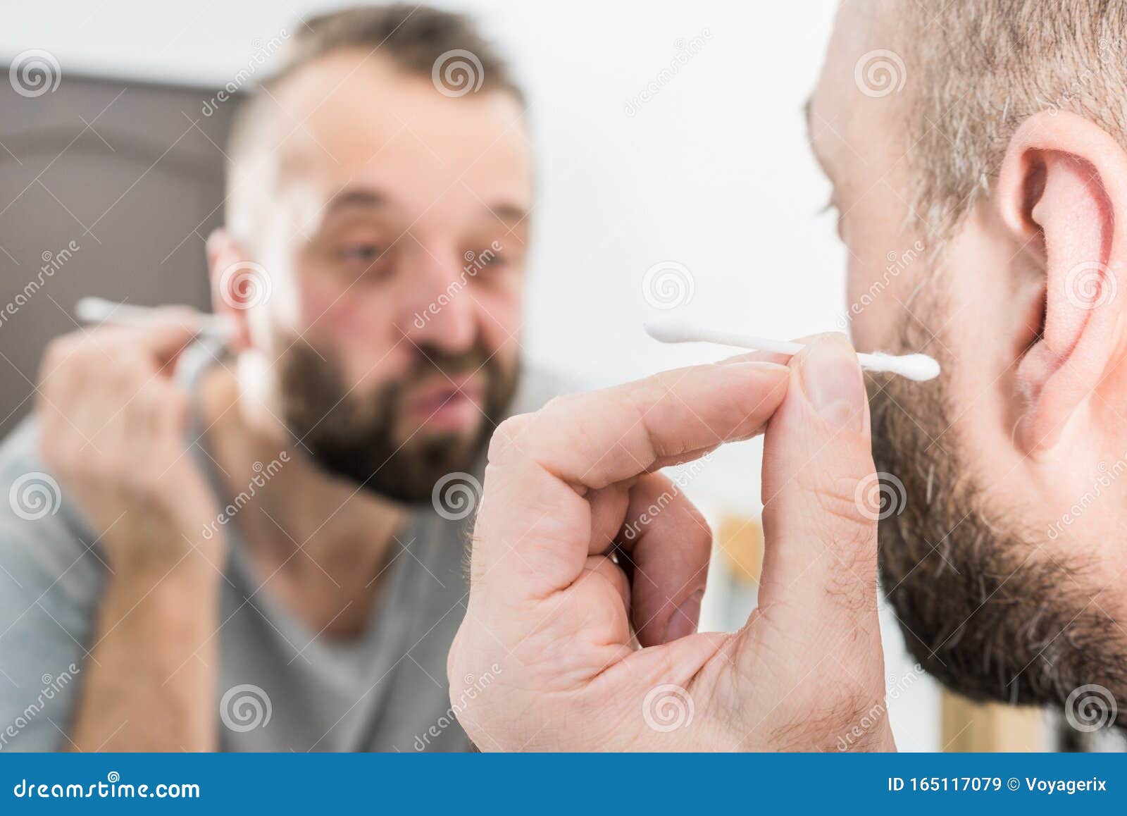 Man Removing Wax From Ear Using Q Tip Stock Image Image Of