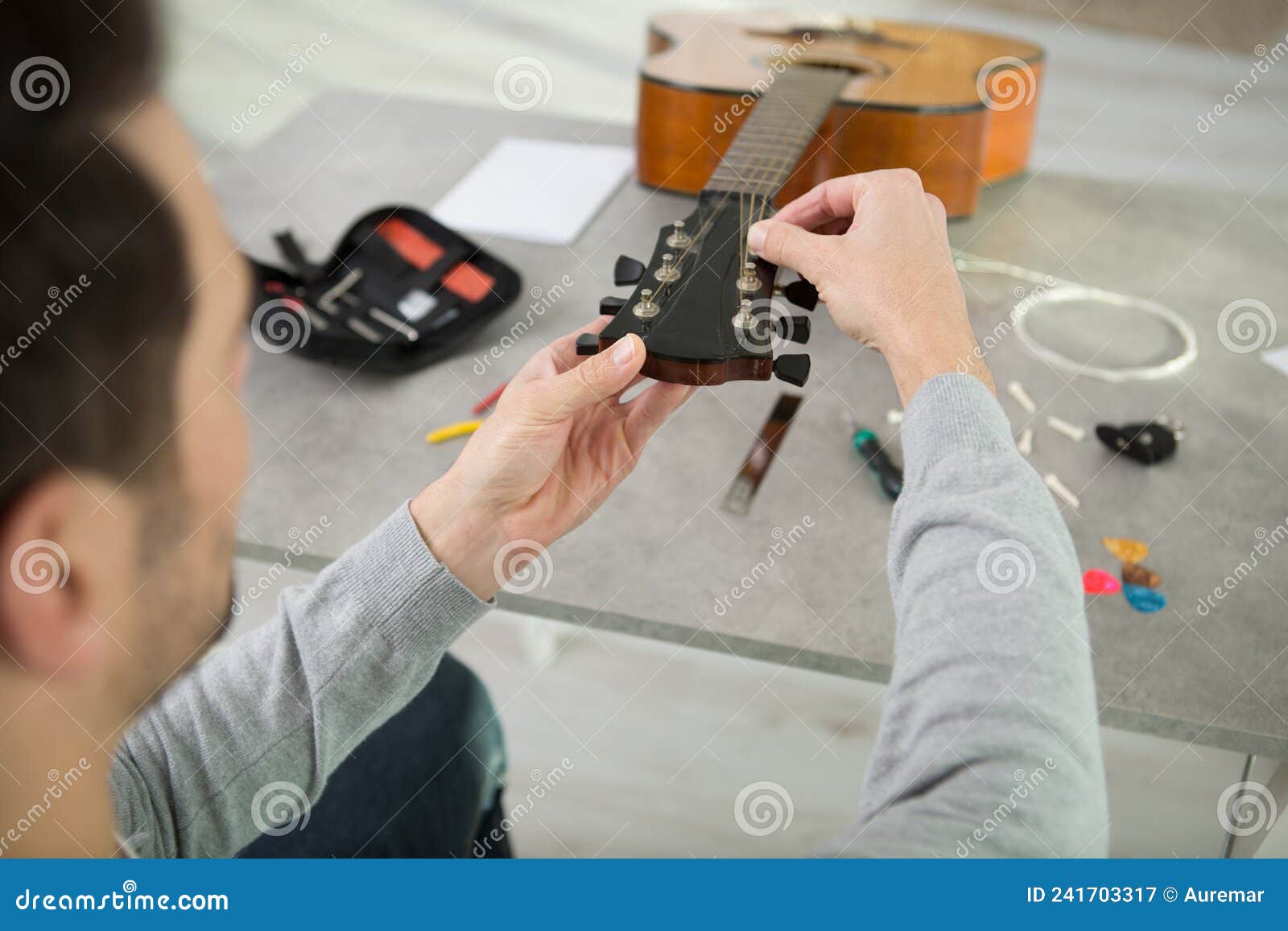 Man Repairing Acoustic Guitar in Workshop Stock Image - Image of ...