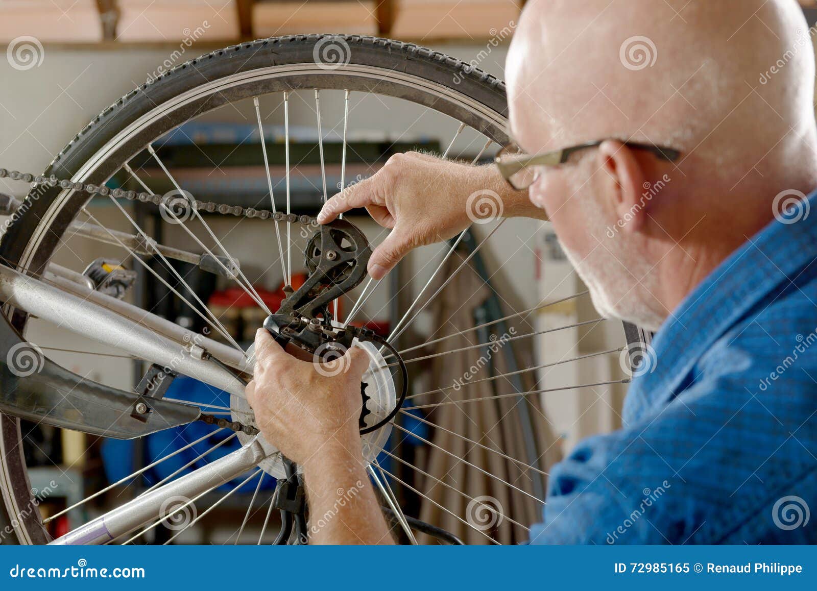 Man Repairing Bike Gear in His Workshop. Stock Image - Image of working ...