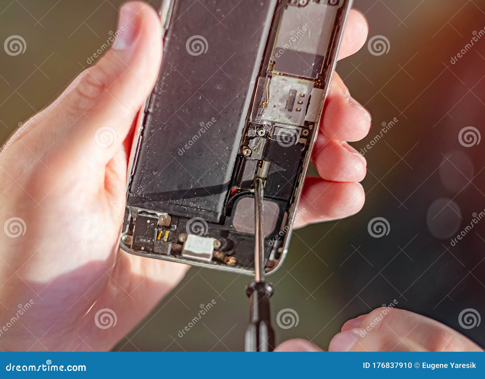 Man is Repairing a Broken Smartphone. Stock Photo - Image of component ...