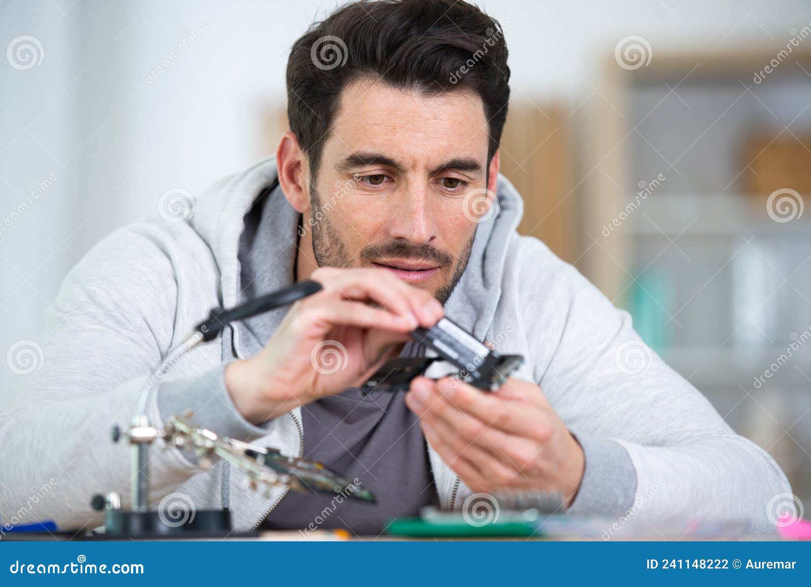 Man Repairing Broken Smartphone in Workshop Stock Photo - Image of ...