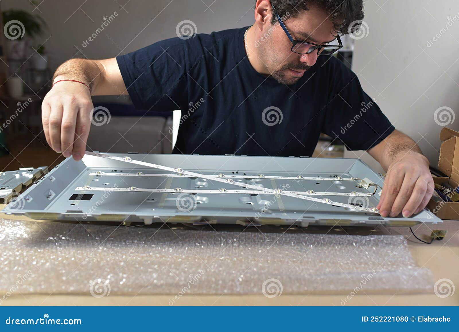 The Man Repairing Broken Tv. Assembly of TV Back Light Modules Stock ...