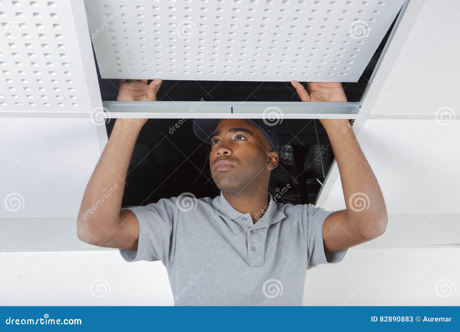 Man repairing in ceiling stock image. Image of repair - 82890883