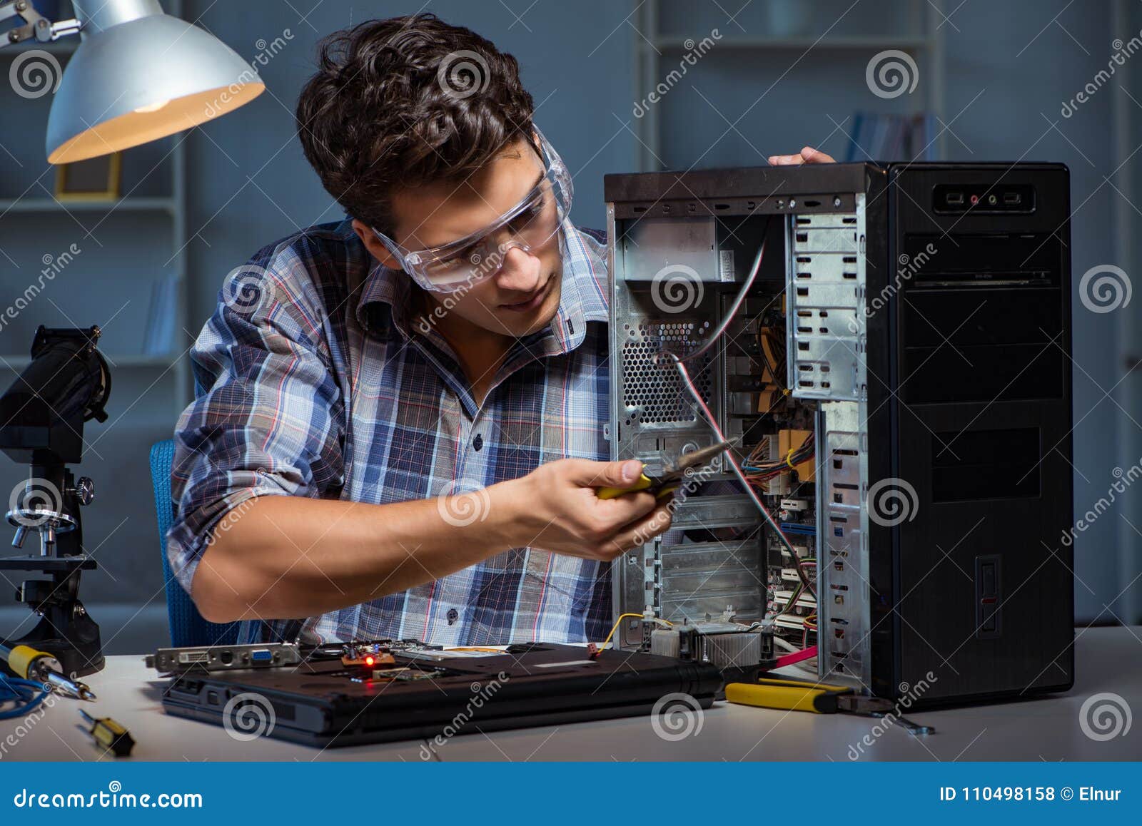 The Man Repairing Computer Desktop with Pliers Stock Photo - Image of ...