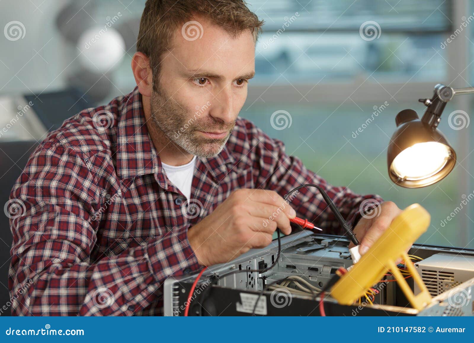 Man Repairing Computer Using Multimeter Stock Photo - Image of male ...