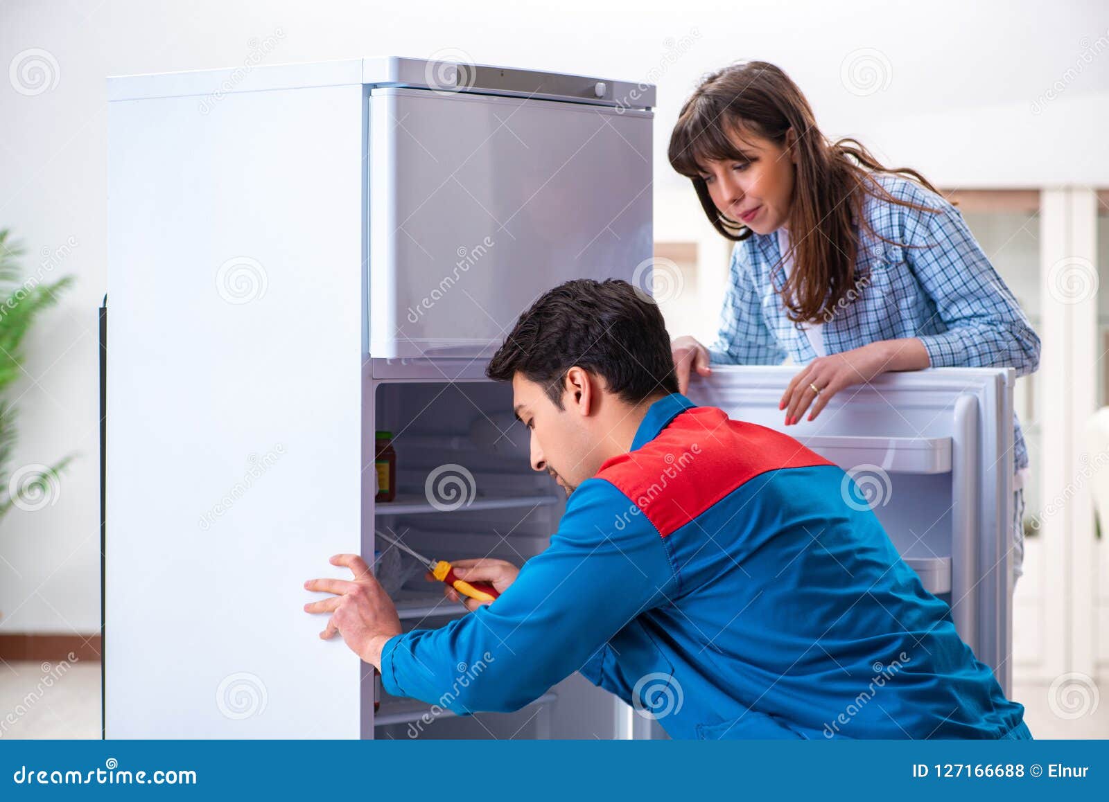 The Man Repairing Fridge with Customer Stock Photo - Image of machine ...