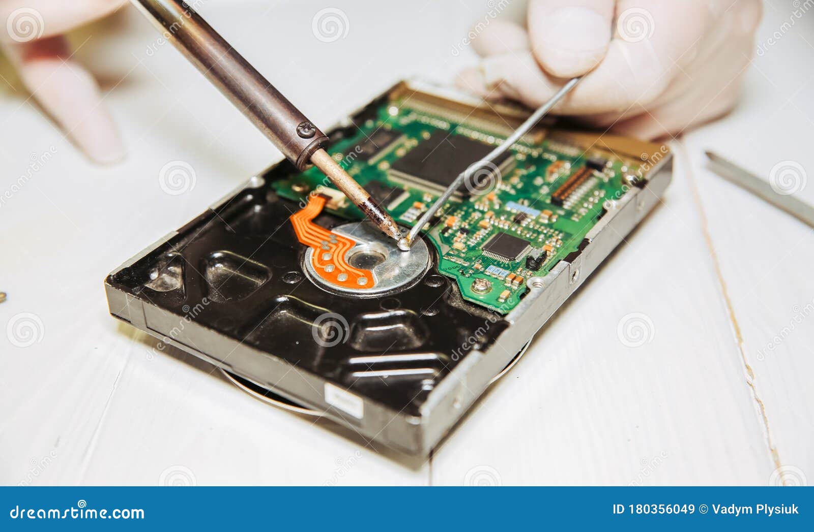 Man Repairing Hard Disk. Inside Details of the Old Personal Computer ...