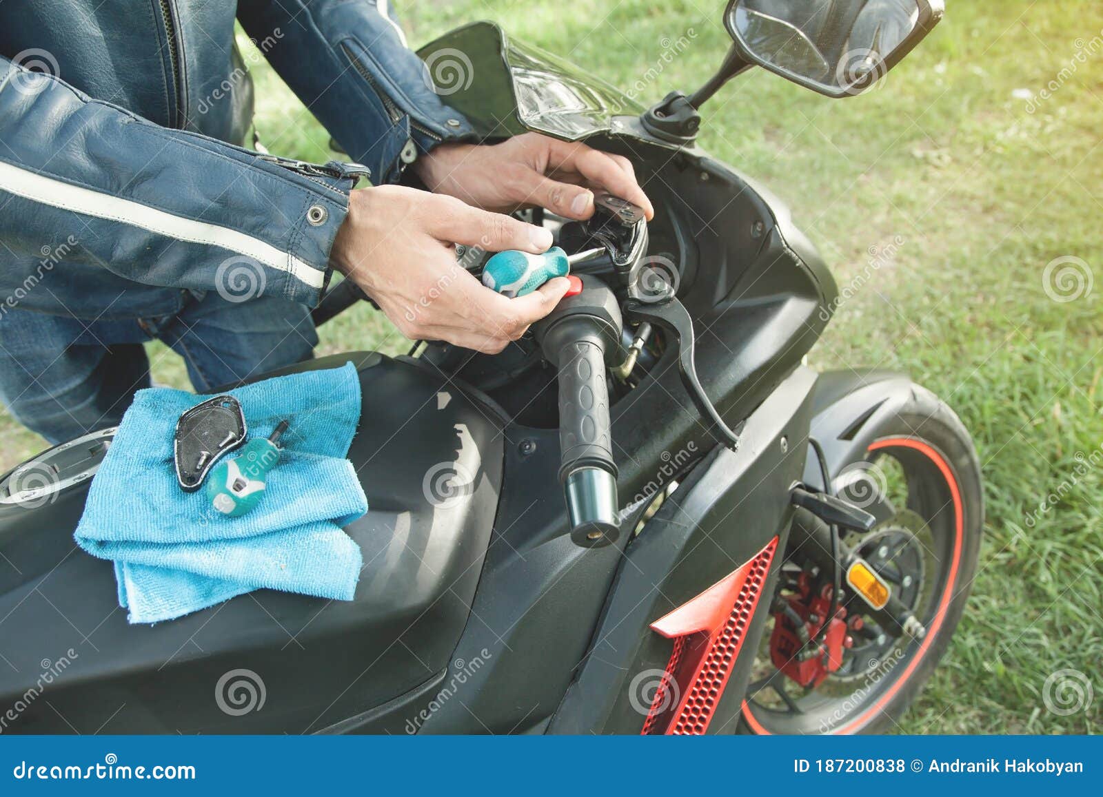 Man Repairing His Motorcycle in the Outdoors Stock Photo - Image of ...