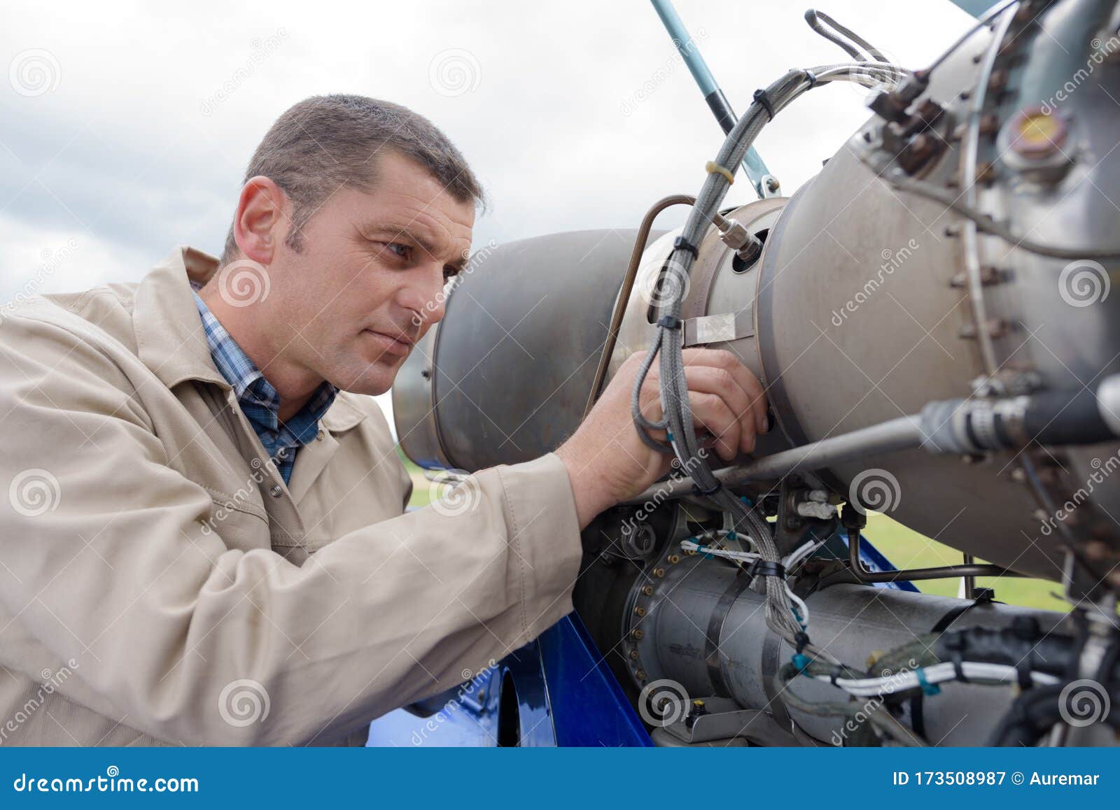 Man Repairing Jet Plane Outdoors Stock Image - Image of middleaged ...