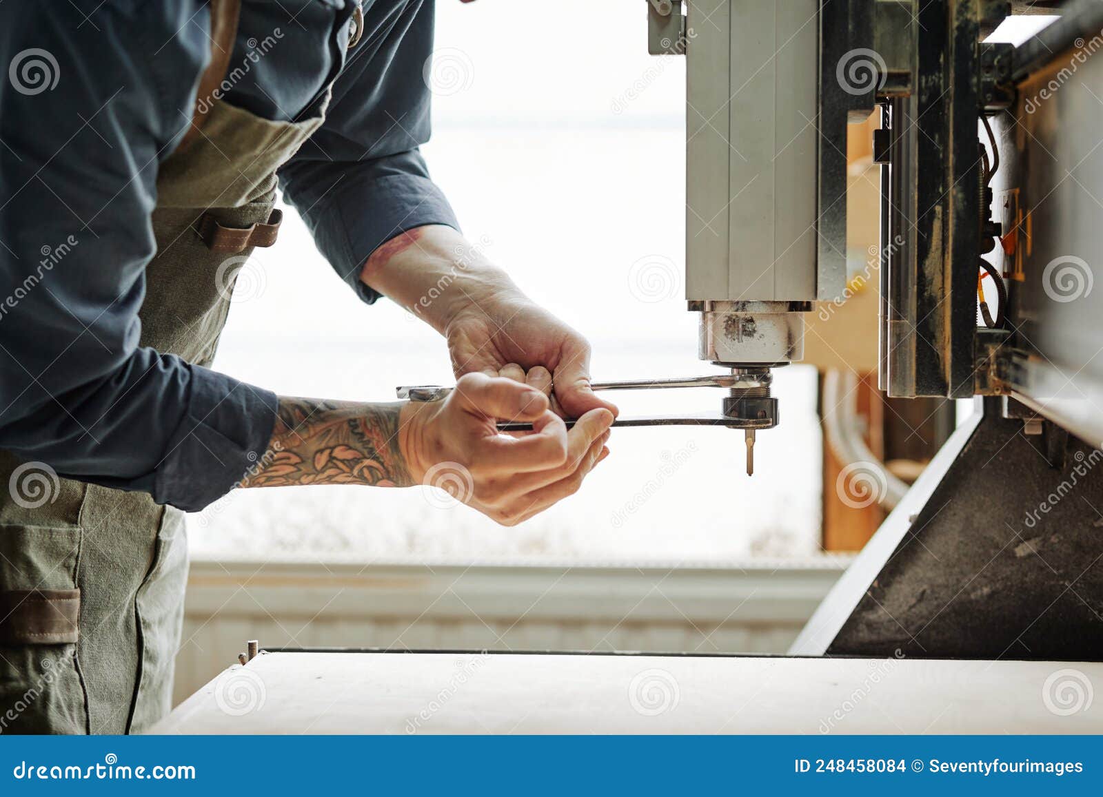 Man Repairing Machine stock photo. Image of tattoo, repair - 248458084