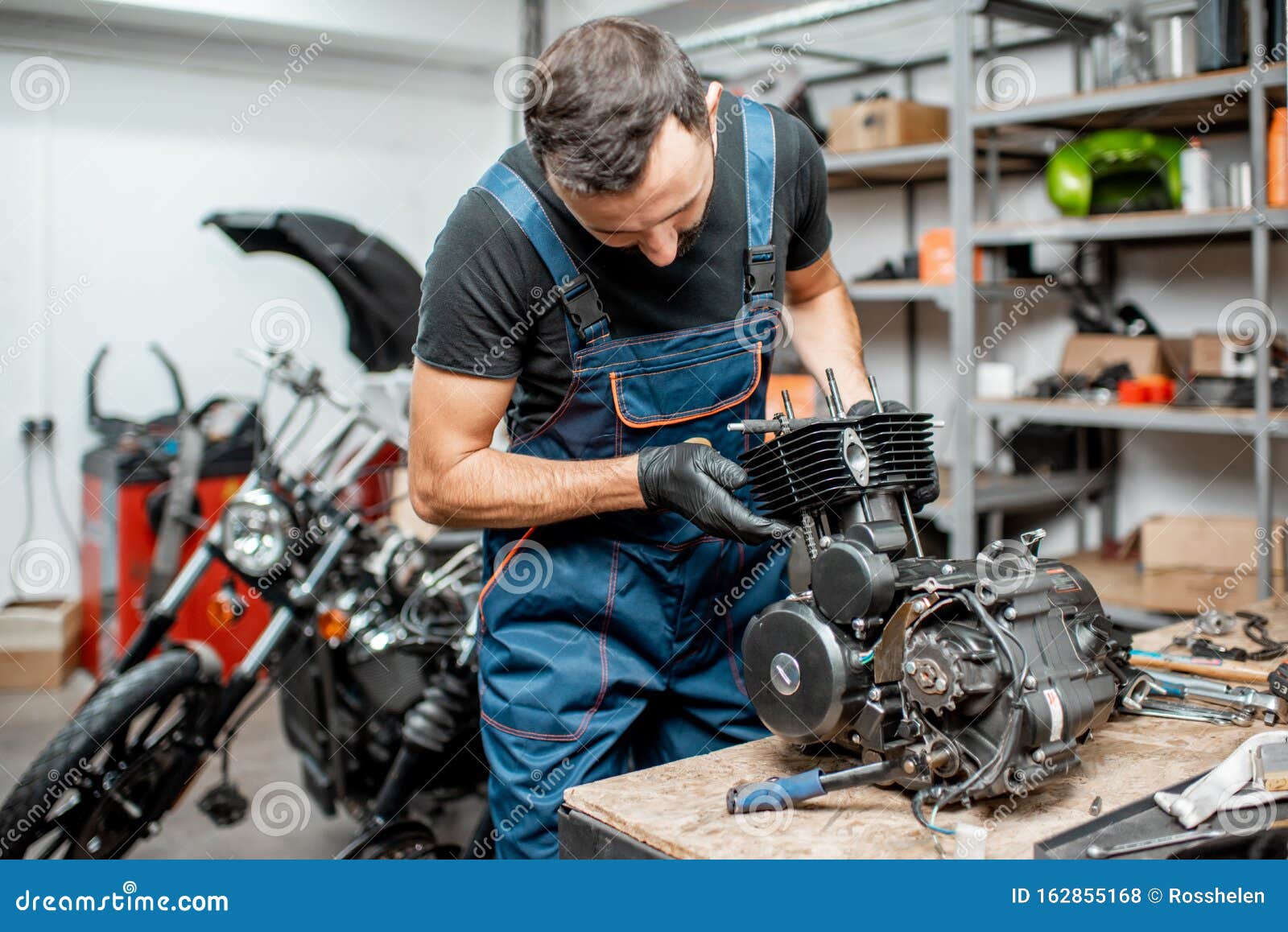 Man Repairing Motorcycle Engine Stock Photo - Image of hand, service ...
