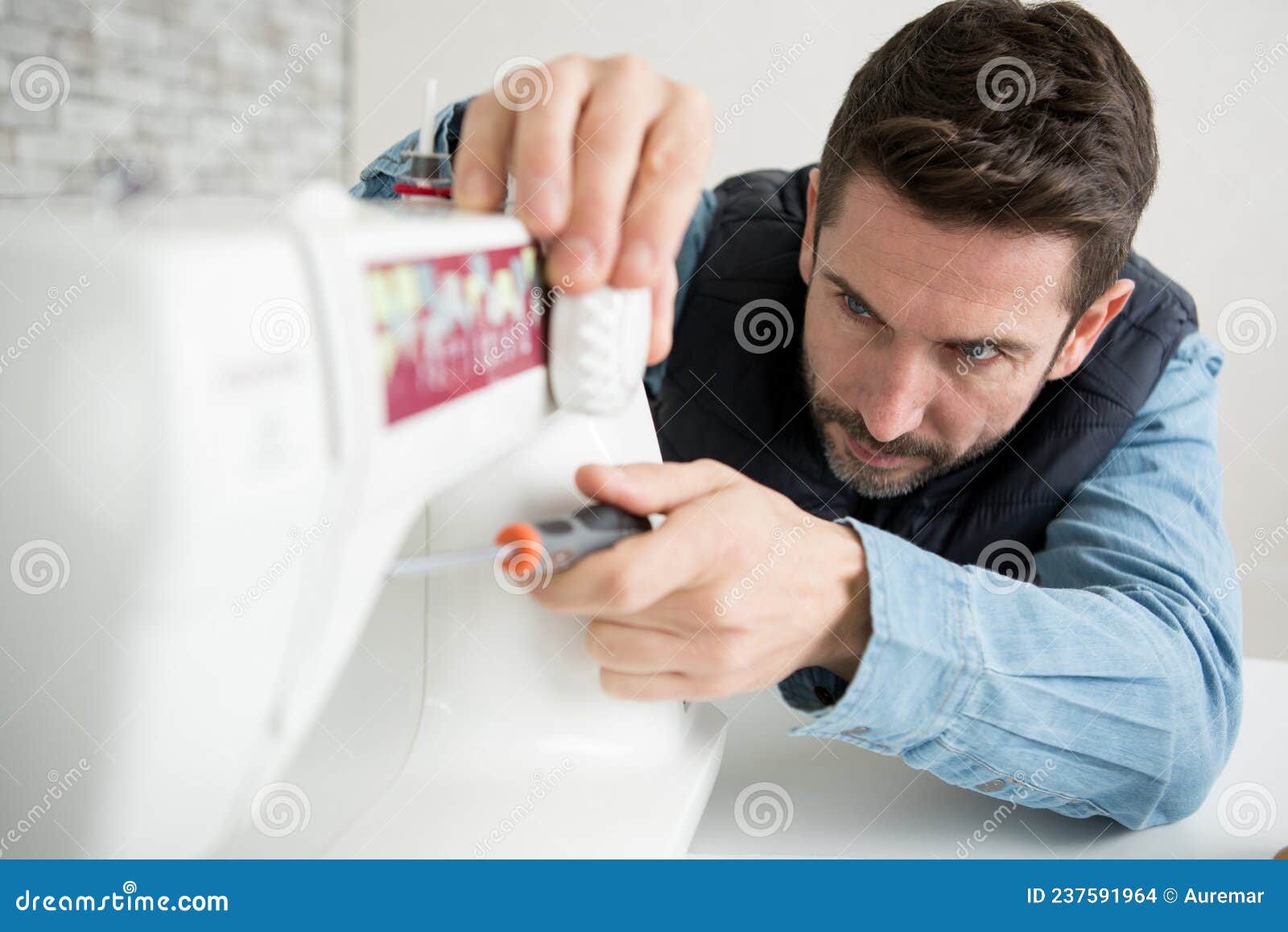 Man Repairing Sewing Machine Stock Photo - Image of electrical, repair ...