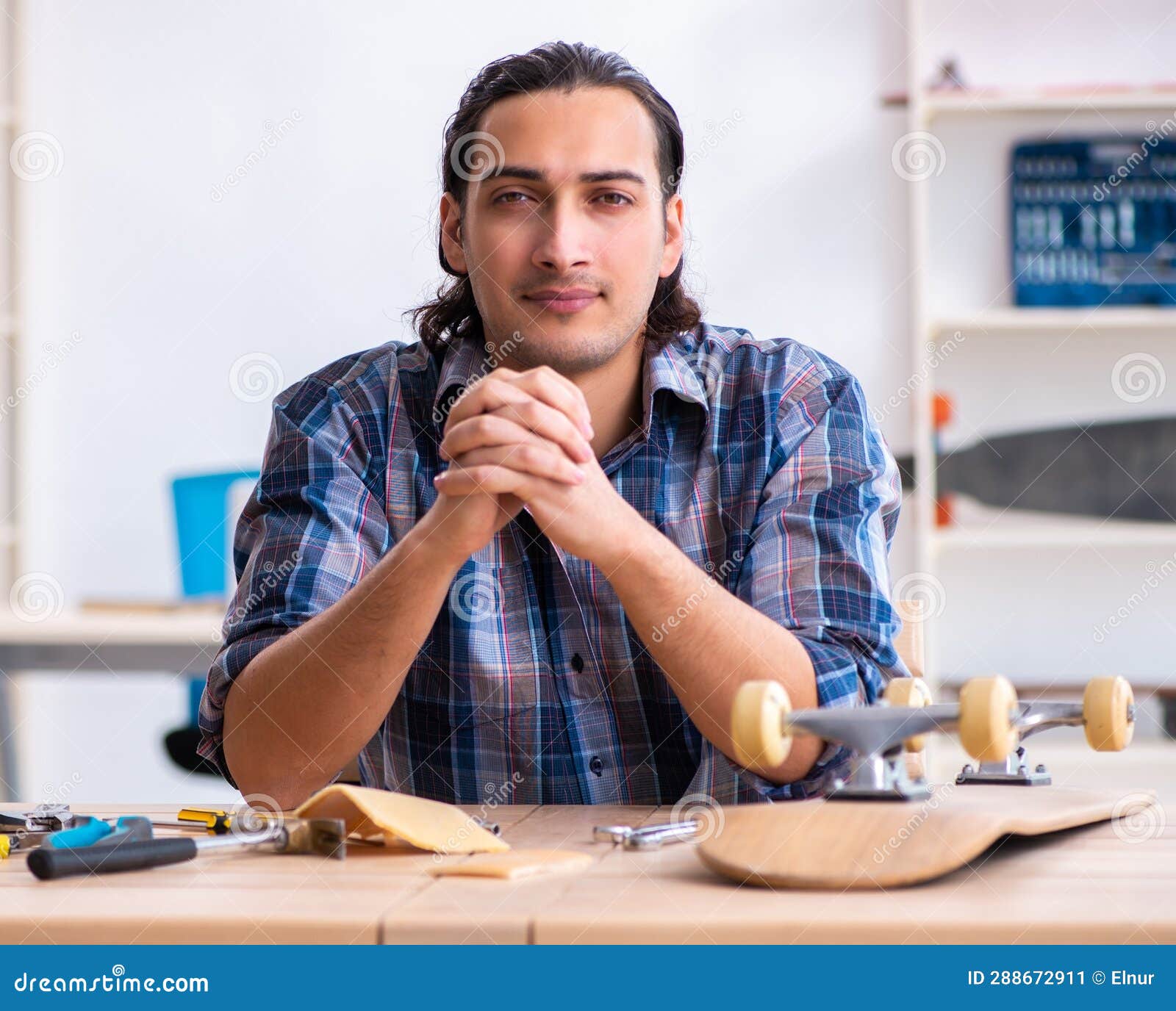 Young Man Repairing Skateboard at Workshop Stock Image - Image of ...