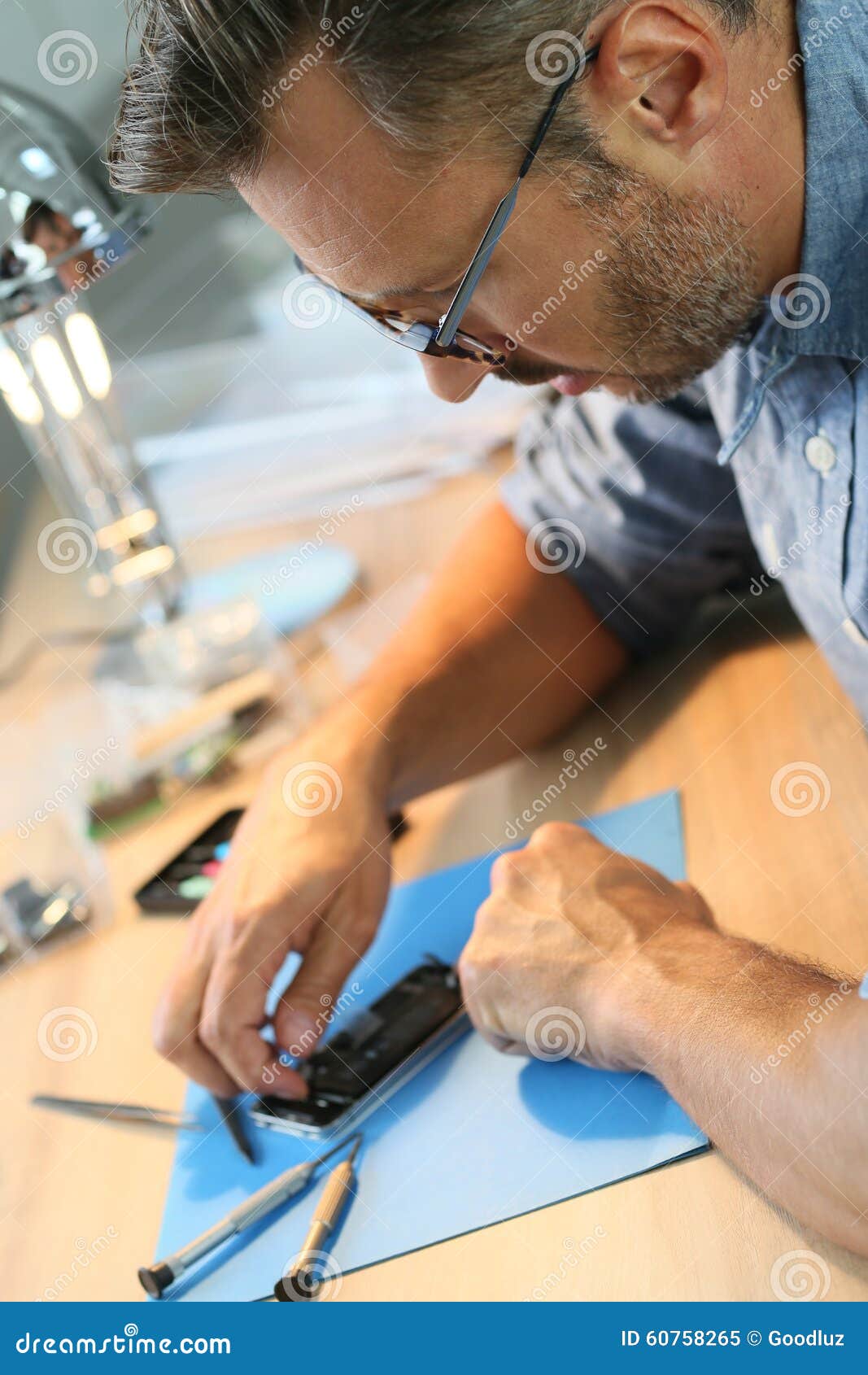 Man Repairing Smartphone in Workshop Stock Image - Image of repair ...