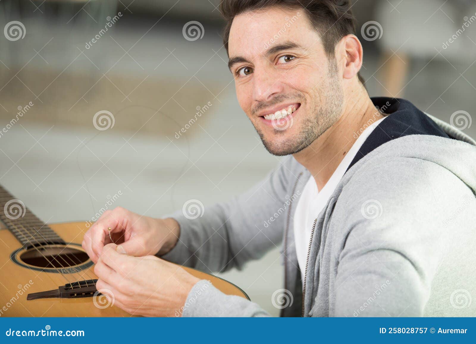 Man Repairing String on Acoustic Guitar Stock Image - Image of musician ...