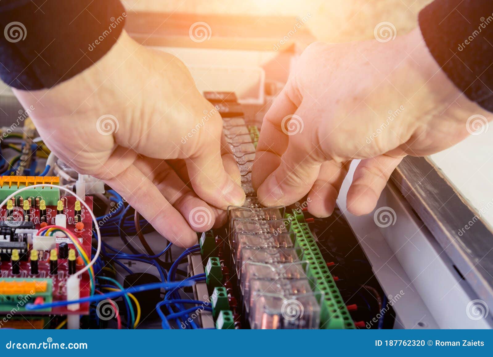 The Man is Repairing the Switchboard Voltage with Automatic Switches ...