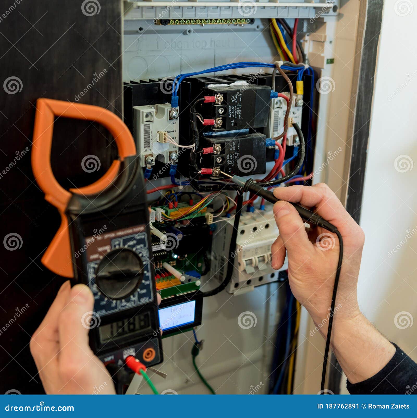 The Man is Repairing the Switchboard Voltage with Automatic Switches ...