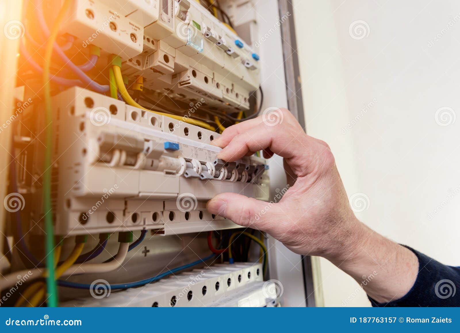 The Man is Repairing the Switchboard Voltage with Automatic Switches ...