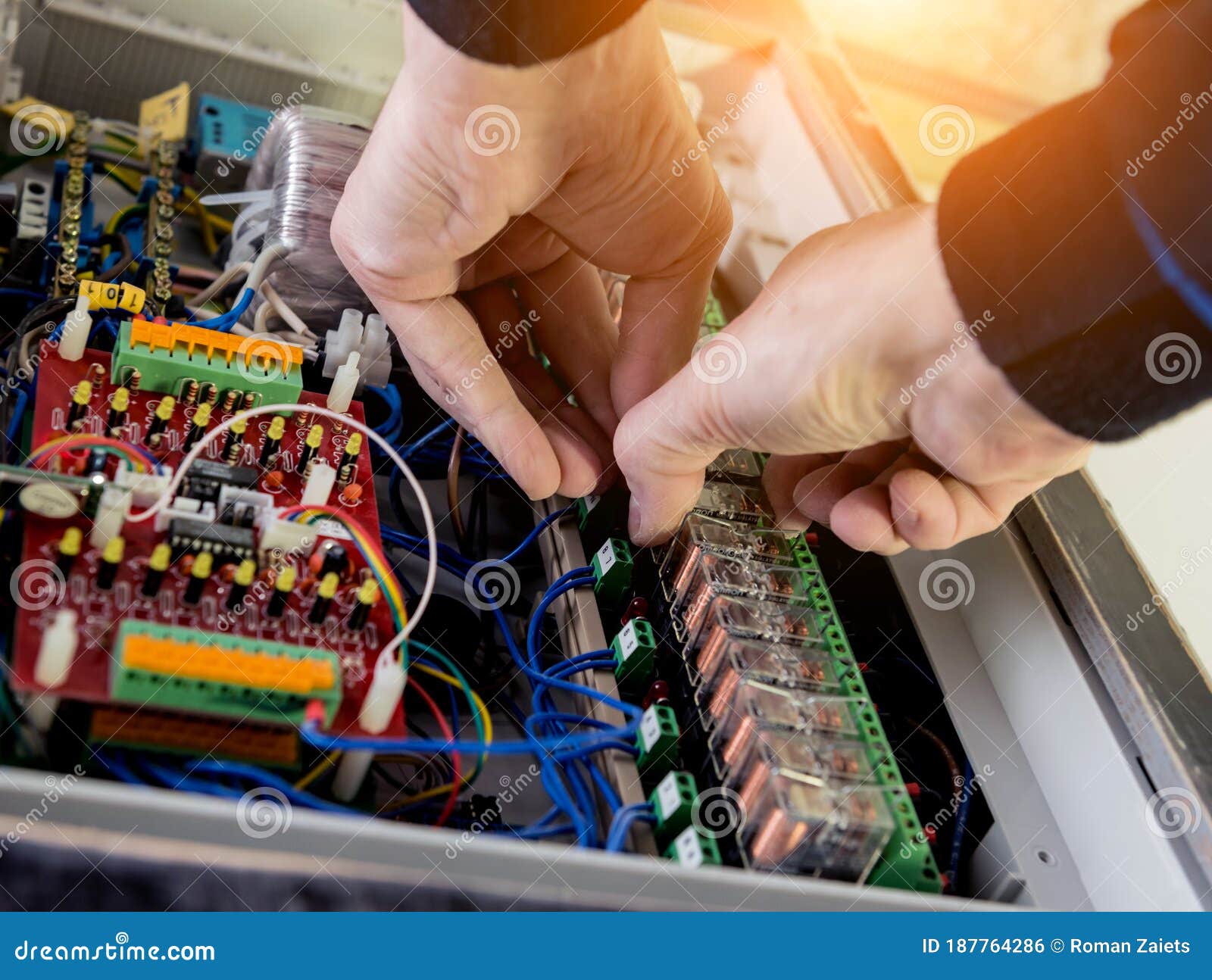 The Man is Repairing the Switchboard Voltage with Automatic Switches ...