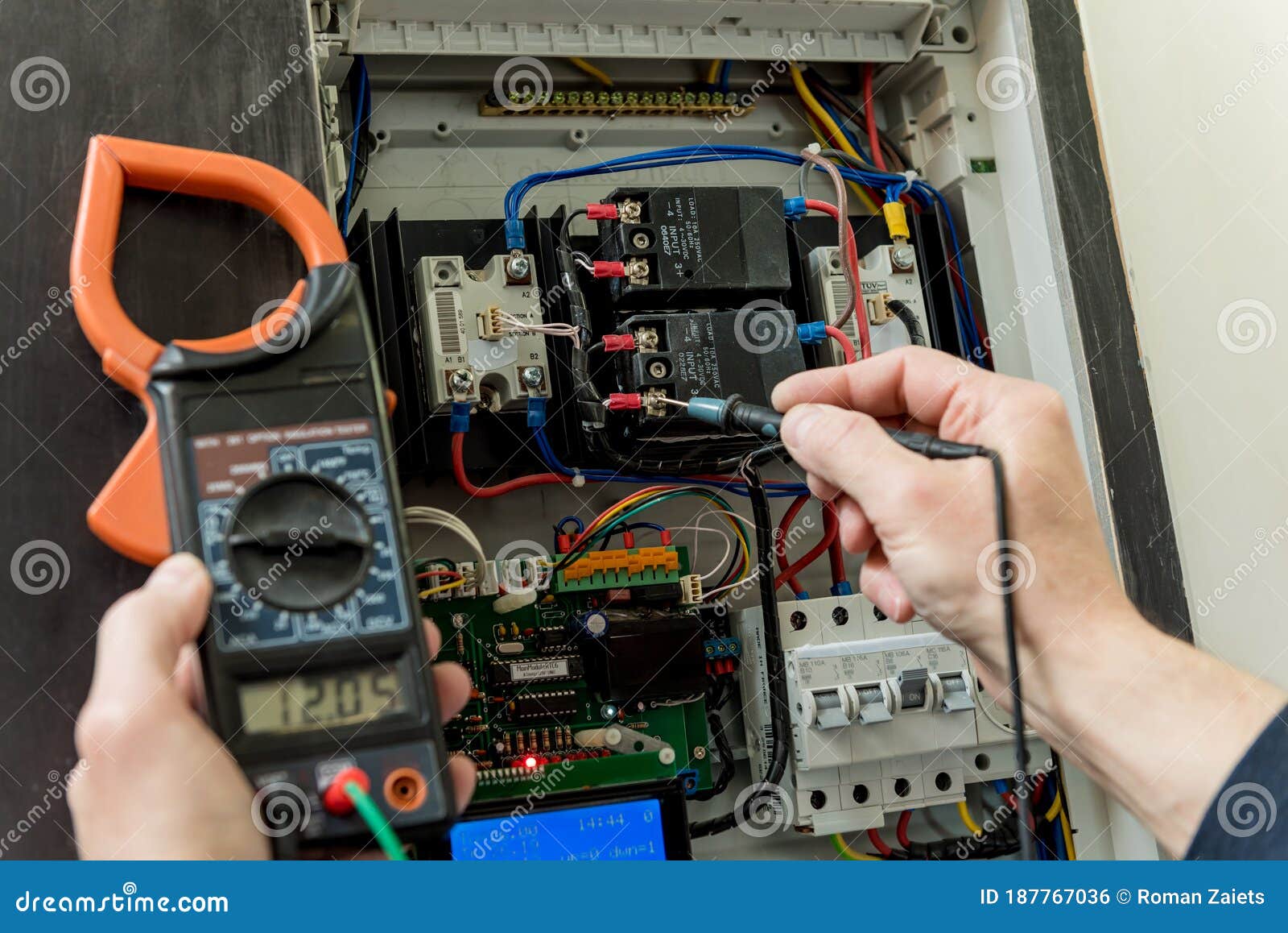 The Man is Repairing the Switchboard Voltage with Automatic Switches ...